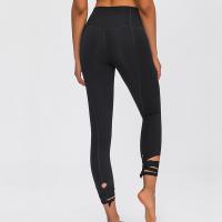 China Strap Leg Women's Stretch Yoga Pants Stretchable Tummy Control Workout Capris for sale
