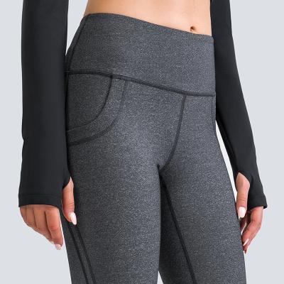 China High Elastic Women's Yoga Tight Pants Naked Feeling Nylon Leggings With Pockets for sale