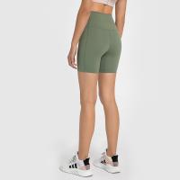 China Nylon Running Women's High Waisted Yoga Shorts With Side Pockets Sports Shorts for sale