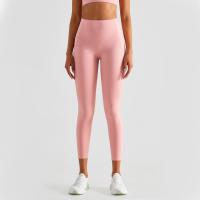 China Nude Side Pocket Peach Hip Fitness Sports Pants Ladies Yoga Leggings for sale