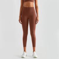 China Nude Side Pocket Peach Hip Fitness Sports Pants Ladies Yoga Leggings for sale