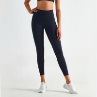 China Nude Side Pocket Peach Hip Fitness Sports Pants Ladies Yoga Leggings for sale