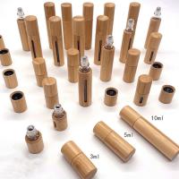 China Recyclable Bamboo Wood Skylight Covered Bamboo Bead Bottle for Perfume/Essential Oil for sale