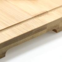 China Stocked Eco-Friendly Kitchenware Multi-Purpose Solid Wood Cutting Board with Handle for sale