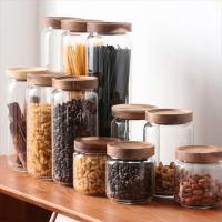 China Custom Capacity Stocked Sealed Clear Round Borosilicate Glass Packaging Containers Jar with Wood Lid for sale