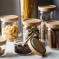 China Custom Capacity Stocked Sealed Clear Round Borosilicate Glass Packaging Containers Jar with Wood Lid for sale