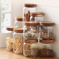 China Custom Capacity Stocked Sealed Clear Round Borosilicate Glass Packaging Containers Jar with Wood Lid for sale