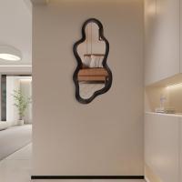 China Beautiful Home Decor Irregular Wall Mirror with Black Wooden Frame and Modern Bathroom Decoration for sale