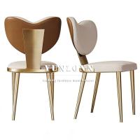 China Beautiful Heart-shaped Leather Chair Luxury Villa Dining Room Furniture Exquisite Metal Feet Dining Chair for sale