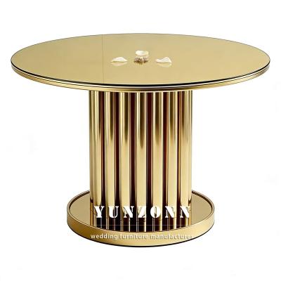 China Luxury Modern Round Shaped Glass Top Golden Stainless Steel Dining Tables Luxury for sale