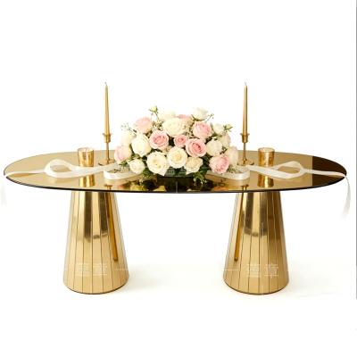 China Gold Stainless Steel Dining Table and Chairs Set Glass Top Wedding Furniture for Hotel Use for sale
