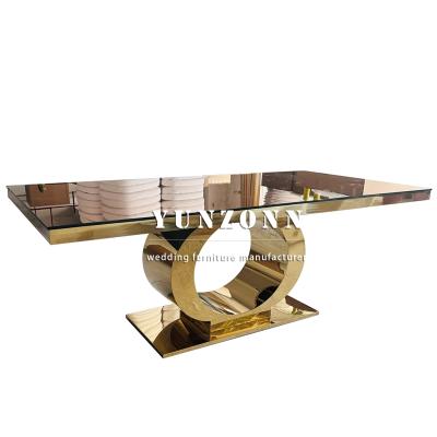 China Best Selling Luxury Round Base Wedding Table Gold Stainless Steel and Mirror Glass Top Modern Design Hotel Furniture for sale