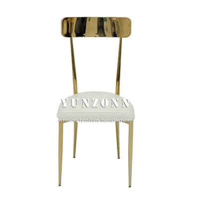 China Contemporary Event Hotel Banquet Furniture White Leather Gold Metal Stackable Wedding Chairs for sale