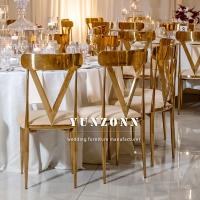 China New Design White Cushion Wedding Hotel Chair with Gold Stainless Steel V-Shaped Back for sale