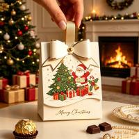 China Christmas Candy Gift Box with Cartoon Santa & Pine Tree Design and Light Luxury Satin White Bow for Holiday Parties for sale