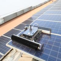 China Automatic Solar Panel Cleaning Robot with Dual Brush Rollers and Water Spray Nozzles for sale
