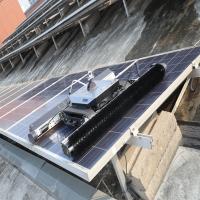 China Automatic Solar Panel Cleaning Robot Water Spray Nozzle and Rotating Brush for Cleaning for sale