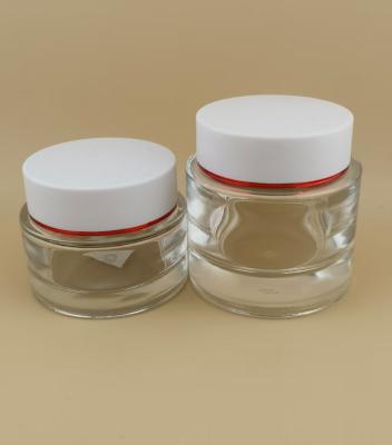 China Clear Glass Cream Jar with White Screw Lid for Female Lotion for sale