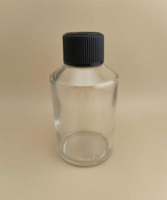China Delicate Design Clear Smooth Round Big Glass Bottle with Special Lid for Medicament for sale