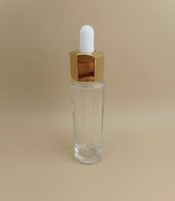 China Customized Clear Dropper Bottle Featuring CRC Possible and Nice Polygon Design Offering Durable Packaging Solution for Essence for sale