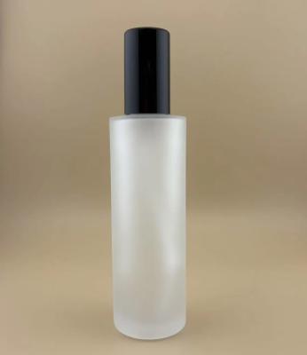 China Matte Transparent Glass Bottle with Black Treatment Pump for Cosmetic for sale