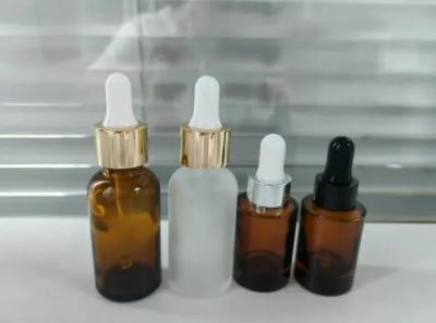 China Transparent Luxury Empty Glass Dropper Bottle Skin Care Oil Dropper Bottle for sale