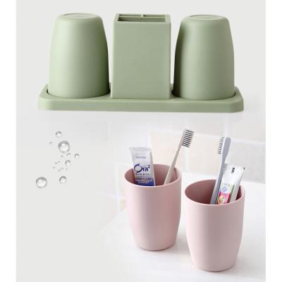 China Toothbrush Holder and Large Toothpaste Stand Organizer Plastic Storage Rack Set Bathroom Accessories for Family, Kids. for sale