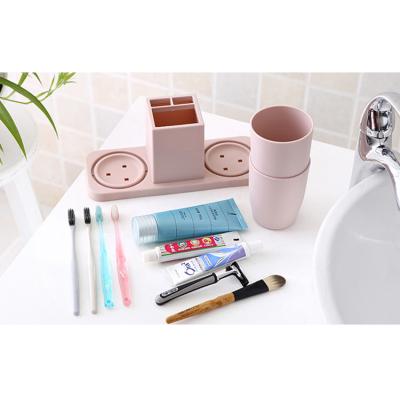China Toothbrush Holder and Large Toothpaste Stand Organizer Plastic Storage Rack Set Bathroom Accessories for Family, Kids. for sale