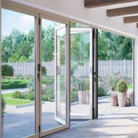 China Finished Surface Modern Commercial Bifold Doors with Tempered Glass and Low-E Glazing for sale