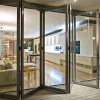 China Finished Surface Modern Commercial Bifold Doors with Tempered Glass and Low-E Glazing for sale