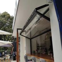 China Residential Horizontal Folding Aluminium Tempered Glass Bifolding Windows For Balcony for sale
