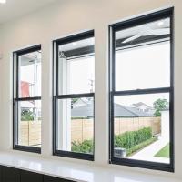 China Vertical Sliding Tempered Glass Double Hung Windows With Stainless Steel Screen Netting for sale