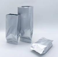 China Glossy Silver Aluminum Foil Laminated Heat Seal Back Sealing Side Gusset Food Packaging Pouch Coffee Bean Bags for sale