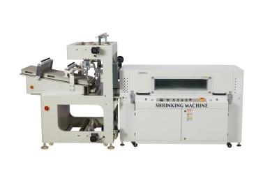 China Spring Type Heat Shrink Packaging Machine Semi Auto Shrink Film Packing Machine For Masking Tape for sale