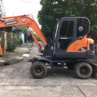 China 5 Ton Used Doosan DX55W Wheel Excavator Mini DX55 Model with Original Hydraulic Valve for sale
