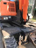 China 5 Ton Used Doosan DX55W Wheel Excavator Mini DX55 Model with Original Hydraulic Valve for sale