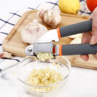 China Stainless Steel Garlic Press And Peeler Set With Non Slip Grip Rust Resistant Design for sale