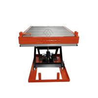 China 1000 kg 2200 lb Hydraulic Scissor Lift Table with Roller Conveyor for Industrial Use for sale