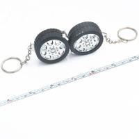 China Tire Shaped Casing Mini Steel Tape Measure Keychain Multifunctional for sale