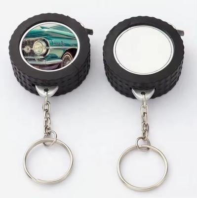 China Custom Logo Tire Shaped Mini Retractable Steel Tape Measure Keychain 1m 3ft for sale