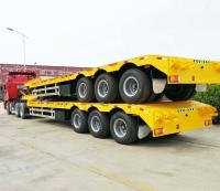 China 3 axles 60tons low flat bed/low boy semi truck trailer heavy loading excavator carrier for sale