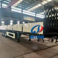 China 9.00-22.5 Rim Tri Axles Drop Side Wall Semi Trailer for Cargo Transport in Russia for sale