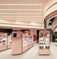China Complete Cosmetic Shop Furniture LED Backlit Cosmetic Display Cabinet Skincare Showcase for sale