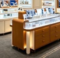 China Custom Luxury Cosmetic Display Cabinet with French-style Arched Design and Eco-friendly Solid Wood for Professional Beauty Boutique Display for sale