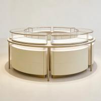 China 360° Curved Tempered Glass LED Illuminated Jewelry Display Cabinet with Hidden Storage Drawer for Boutiques for sale