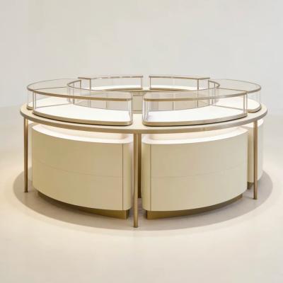 China 360° Curved Tempered Glass LED Illuminated Jewelry Display Cabinet with Hidden Storage Drawer for Boutiques for sale