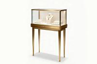 China Luxury Brushed Gold Frame Jewelry Display Cabinet with Built-In LED Light and Lockable Storage Drawer for sale