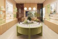 China Minimalist Pastel Green Circular Perfume Display Cabinet With Wall Mount Storage Cabinets and Multi-Layer Classified Display for sale