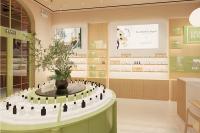 China Minimalist Pastel Green Circular Perfume Display Cabinet With Wall Mount Storage Cabinets and Multi-Layer Classified Display for sale
