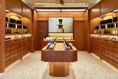 China Natural Solid Wood Perfume Display Cabinet with Illuminated Wall Display and Multi Drawer Storage for sale